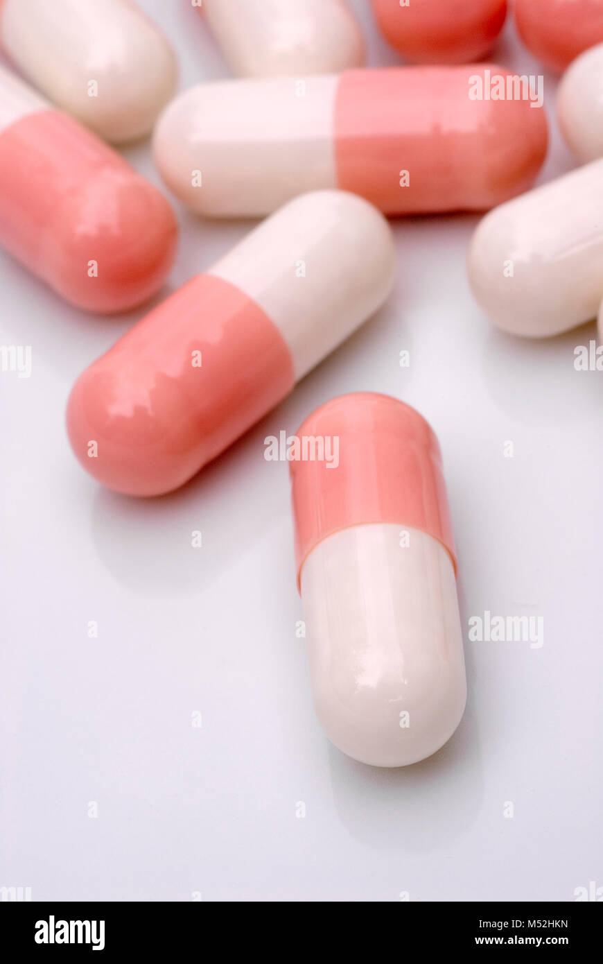 medicinal capsules (pills) bi-color on a white background Stock Photo ...