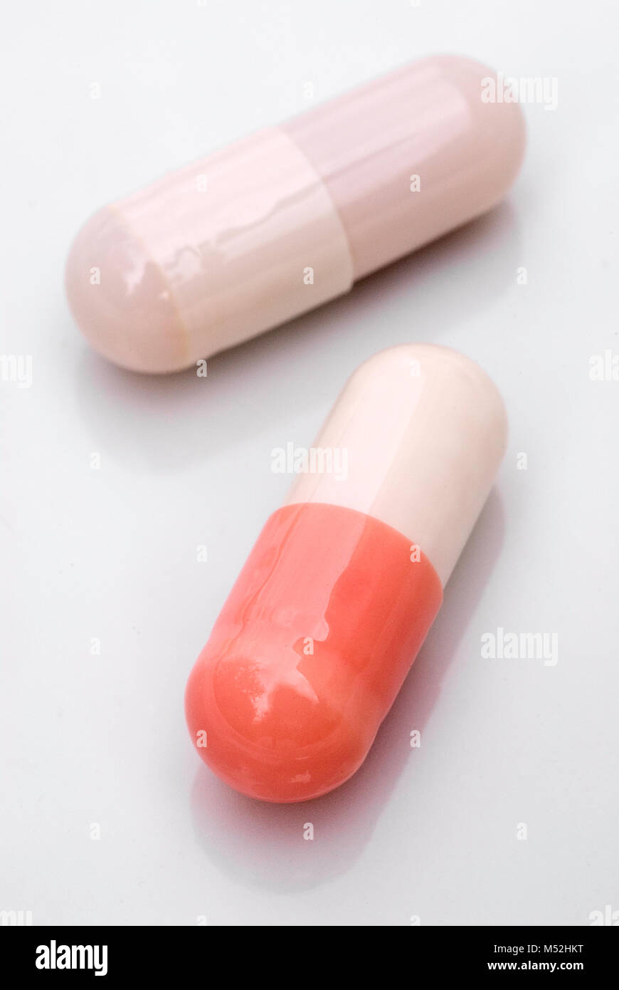 medicinal capsules (pills) bi-color on a white background Stock Photo ...