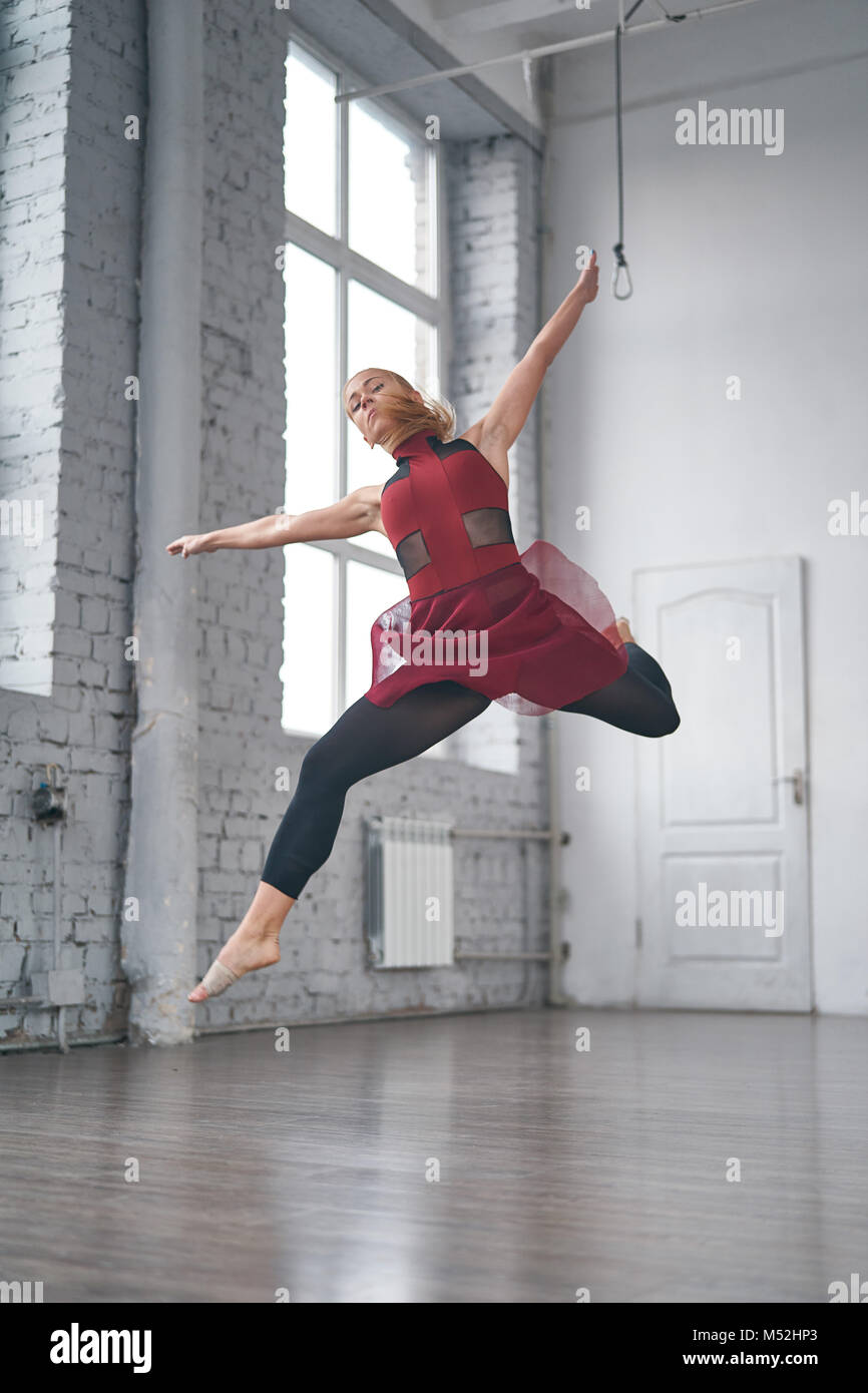 Young female dancer jumping and dancing in the gym Stock Photo - Alamy