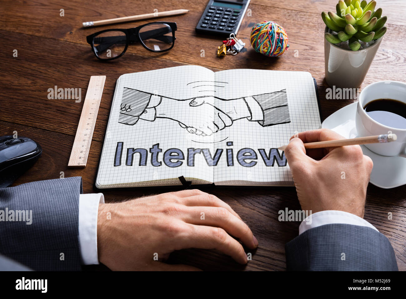 Close-up Of A Human Hand Drawing Interview Concept In Paper Grind On ...