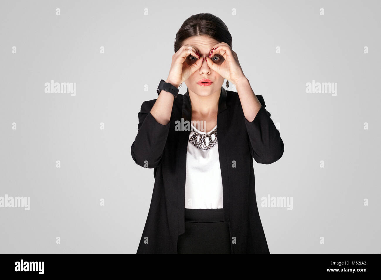 Binoculars sign .Woman have a bad sight. Looking far away and don't see ...