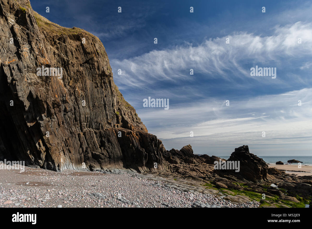 Wales landscape ocean rocky beach cloudy blue sky wide angle shot Stock ...
