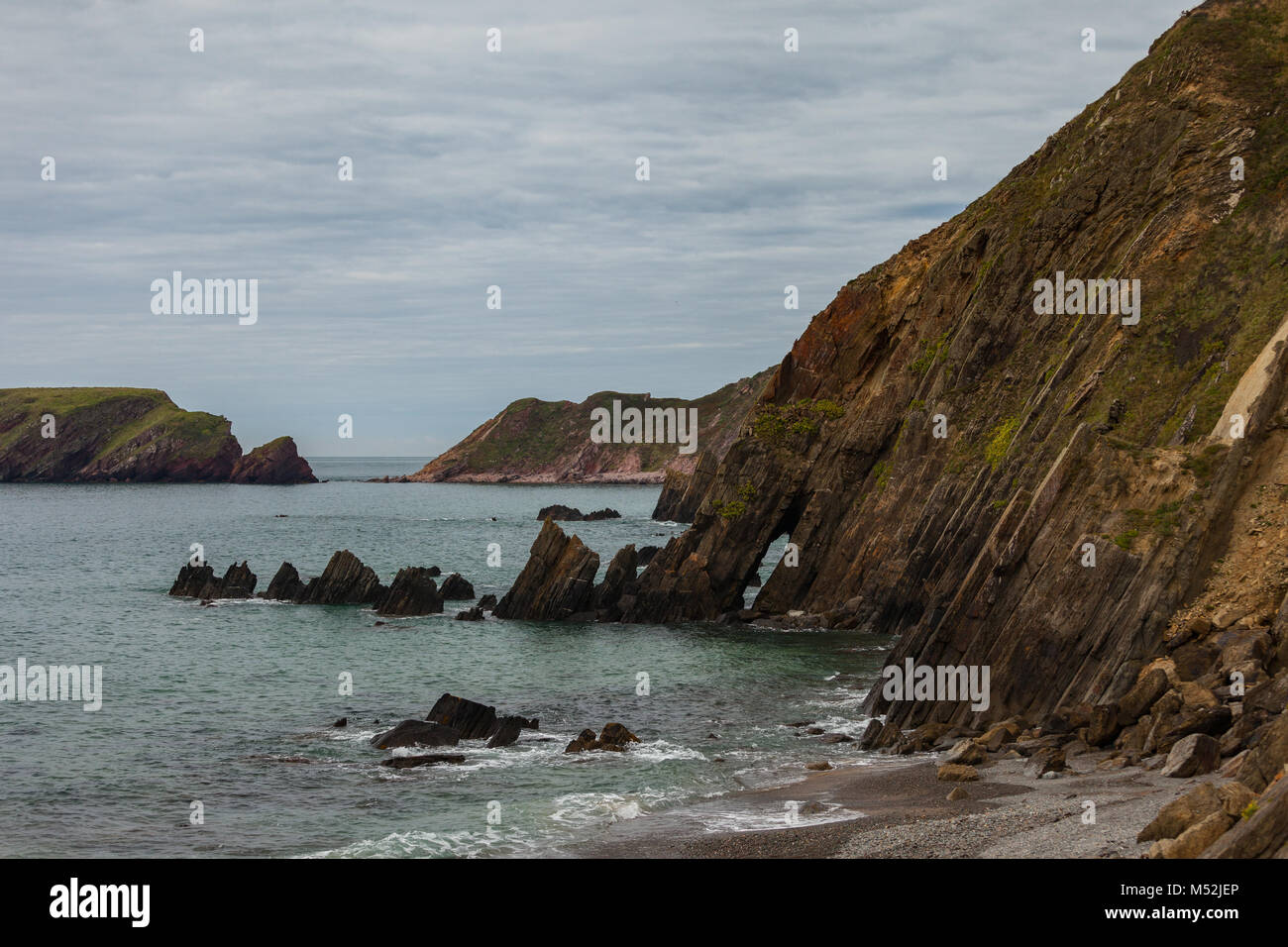 Wales landscape ocean rocky beach cloudy blue sky wide angle shot Stock ...