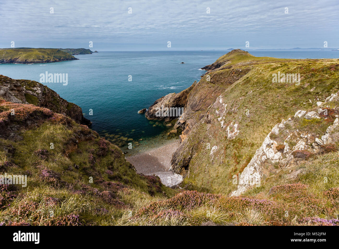 Wales landscape ocean rocky beach cloudy blue sky wide angle shot Stock ...