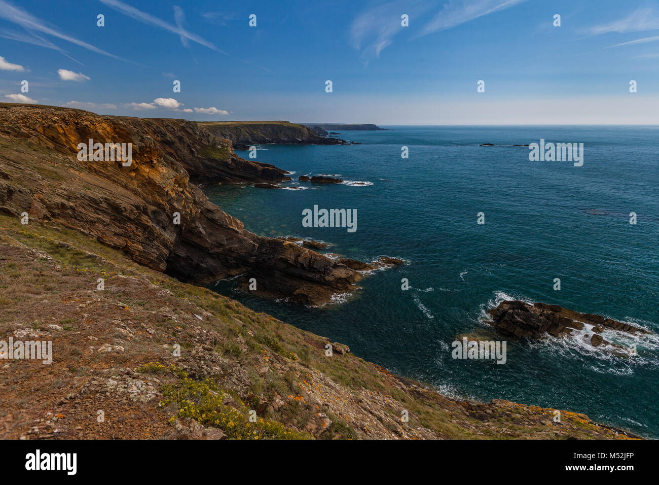 Wales landscape ocean rocky beach cloudy blue sky wide angle shot Stock ...