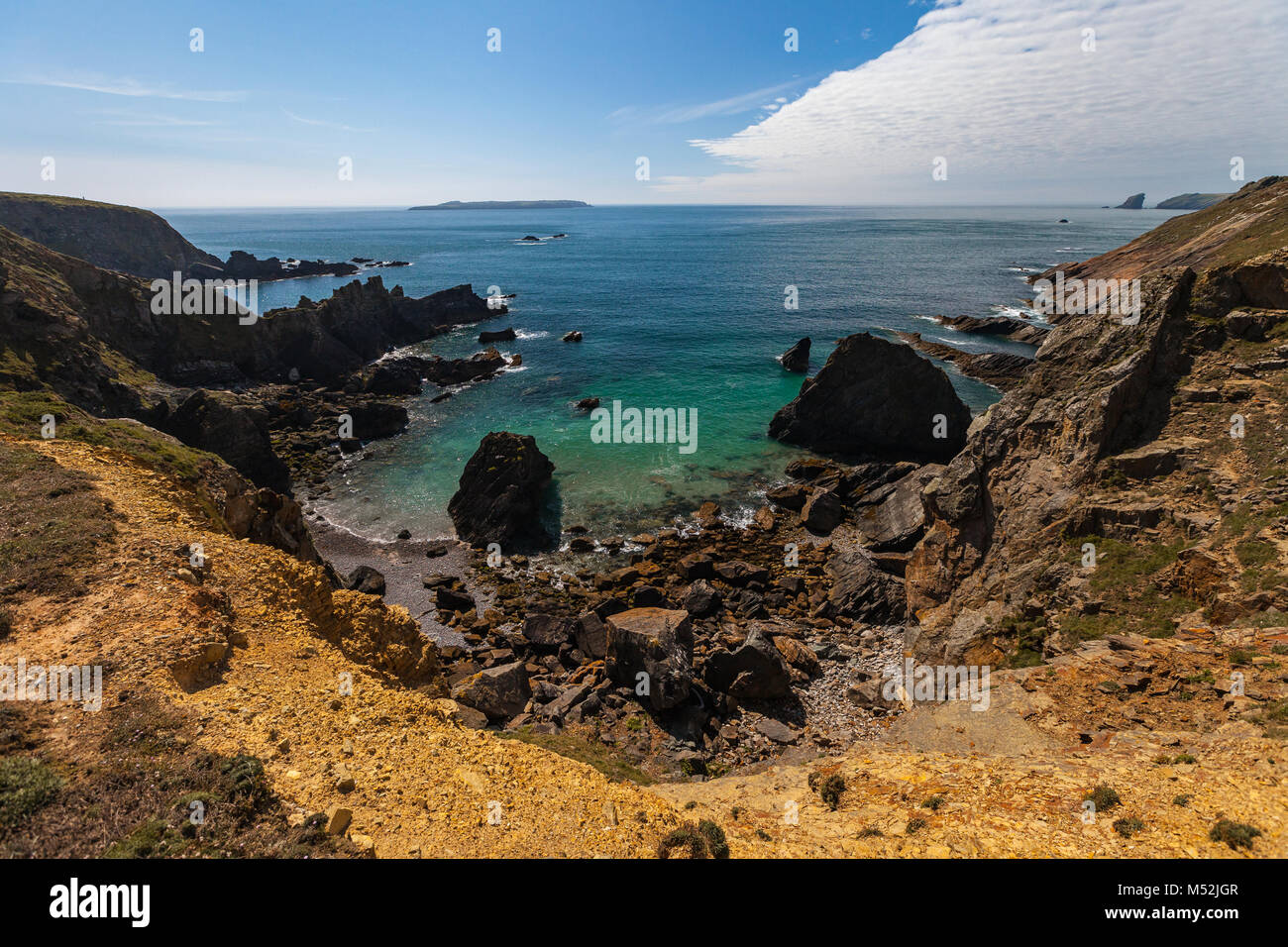 Wales landscape ocean rocky beach cloudy blue sky wide angle shot Stock ...