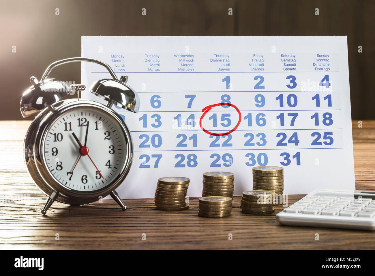Red Circle Marked On Calendar With Clock And Coins Stack On Wooden Desk ...