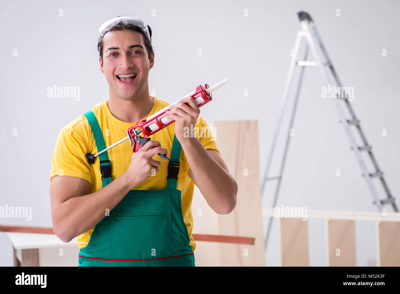 Construction worker working on contractor site Stock Photo - Alamy