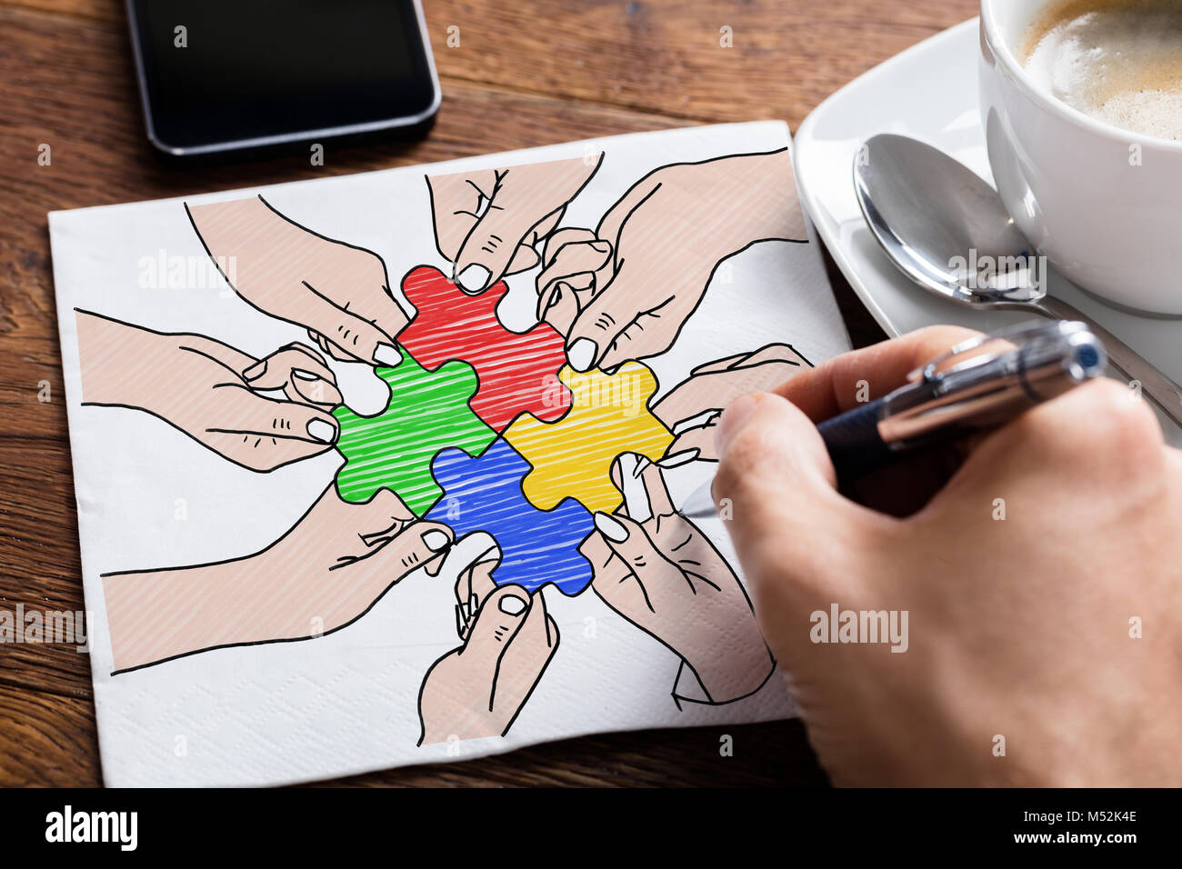 Hand drawing partnership puzzle on hi-res stock photography and images ...