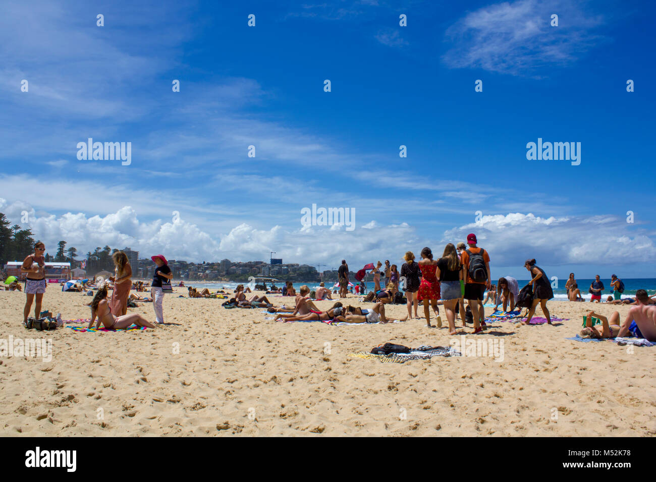 People at Australian beach with city on the background Stock Photo - Alamy