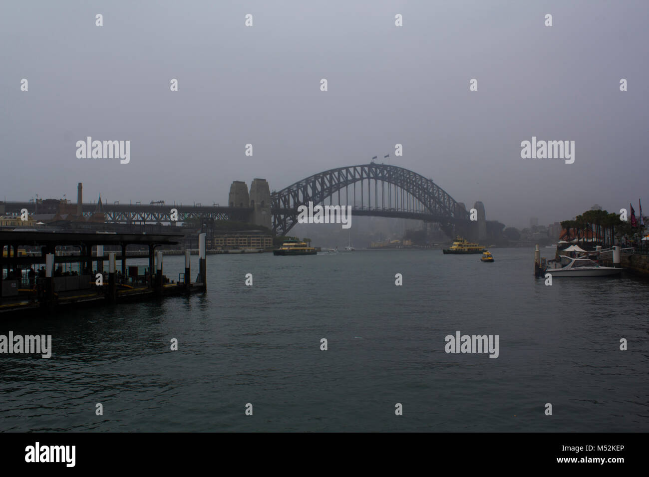 Sydney Harbour Bridge on a dark foggy day Stock Photo - Alamy
