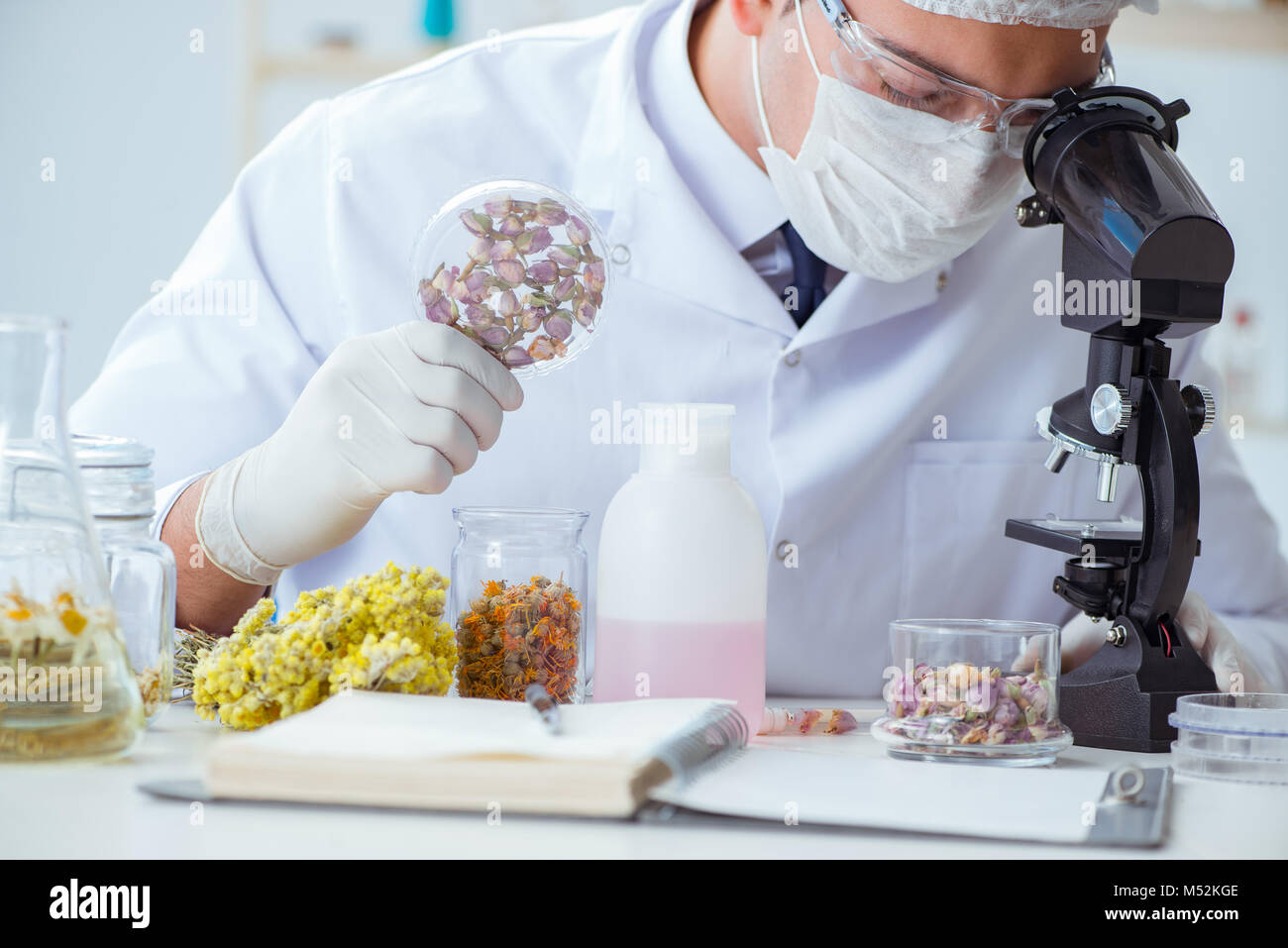 Chemist mixing perfumes in the lab Stock Photo - Alamy