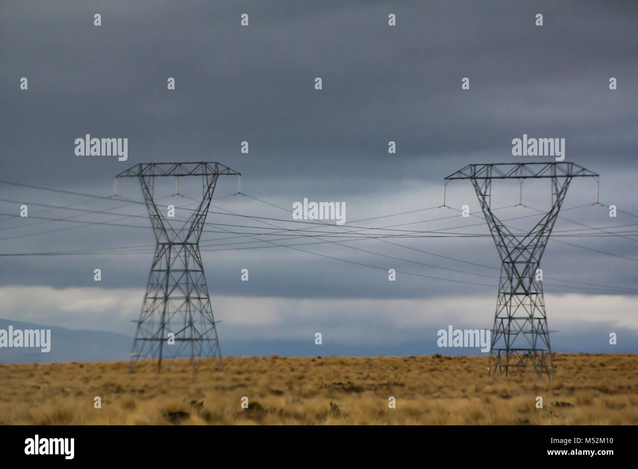 Power Pylons on Desert landscape Stock Photo - Alamy