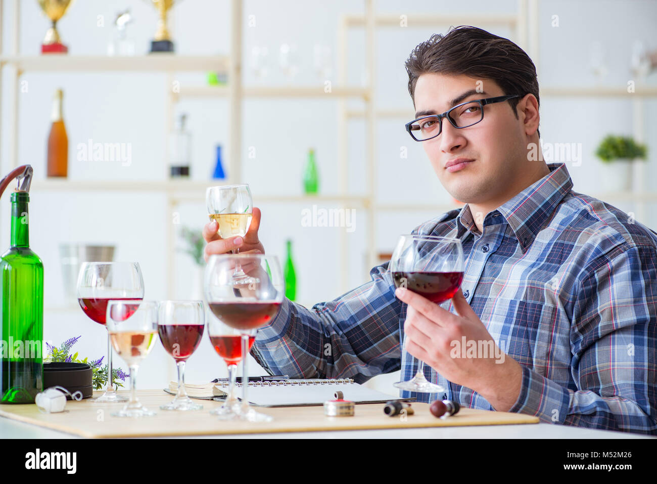 Professional sommelier tasting red wine Stock Photo - Alamy