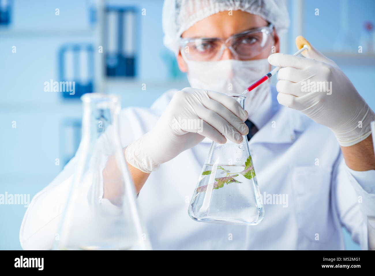 Biotechnology concept with scientist in lab Stock Photo - Alamy