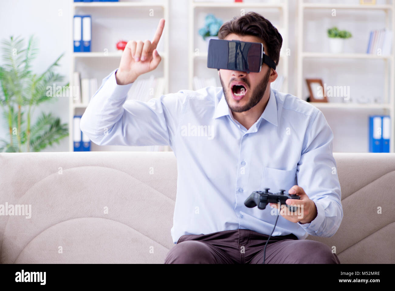 Student gamer playing games at home Stock Photo - Alamy