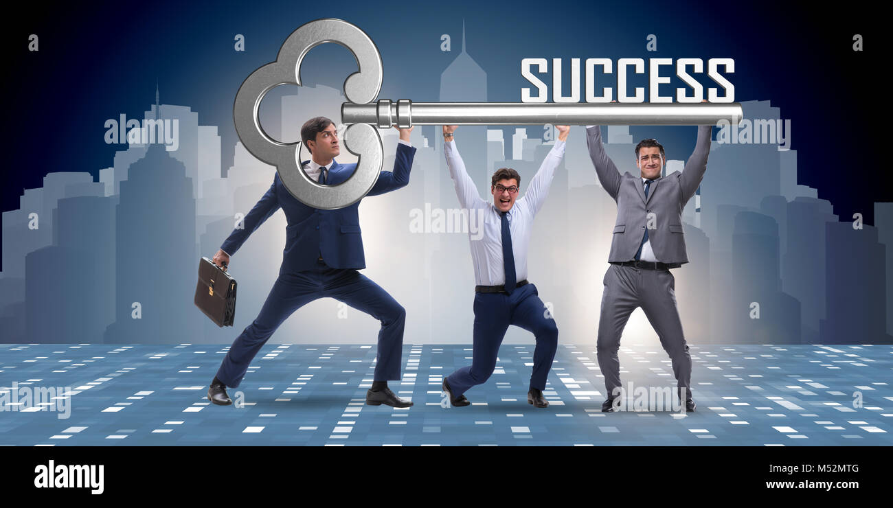 Businessmen holding giant key in business concept Stock Photo - Alamy