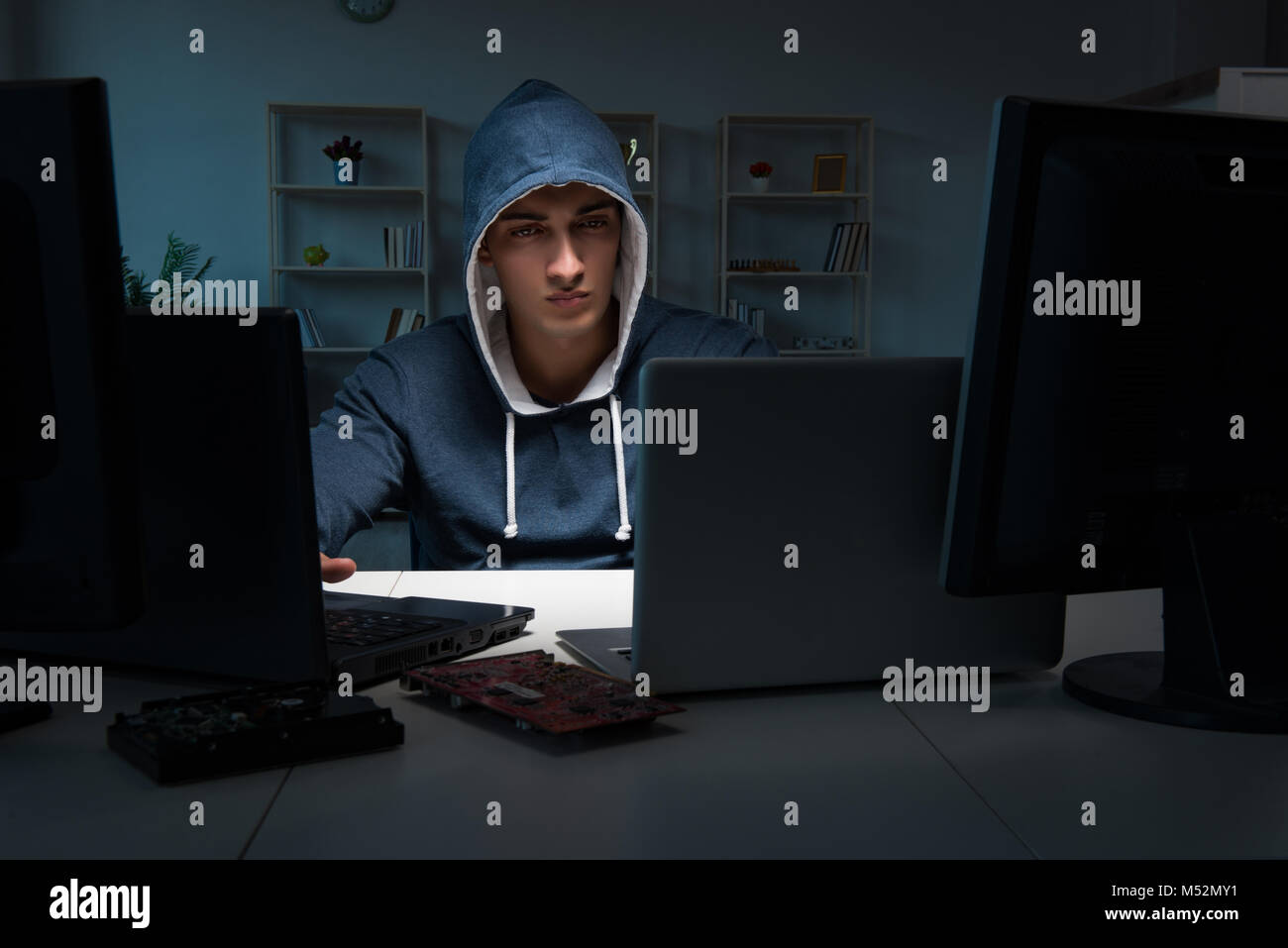 Hacker hacking computer at night Stock Photo - Alamy
