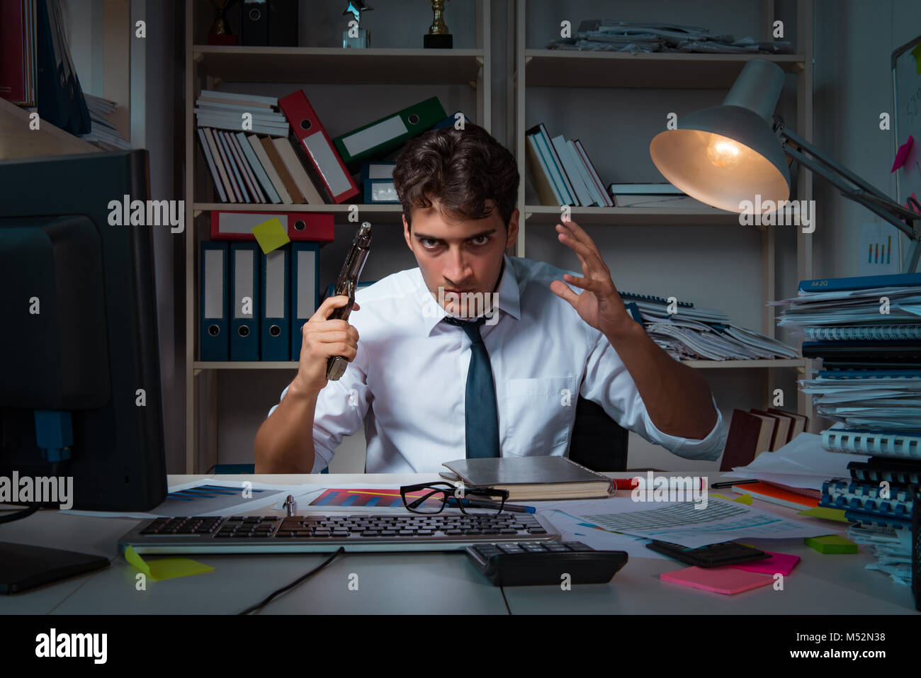 Man businessman working late hours in the office Stock Photo - Alamy