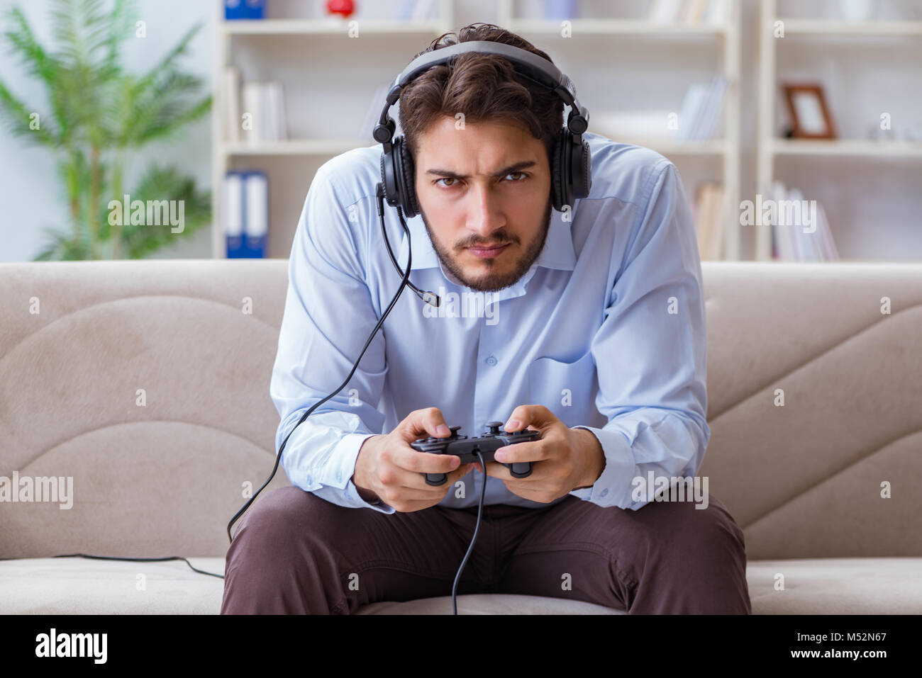 Student gamer playing games at home Stock Photo - Alamy