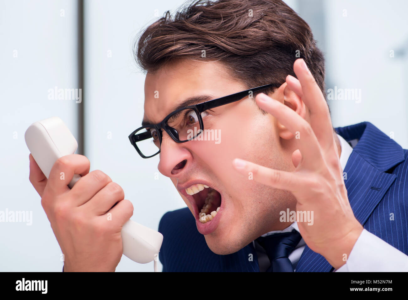 Angry call center employee yelling at customer Stock Photo - Alamy