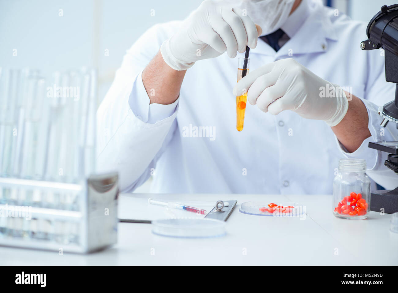 Doctor testing patients urine for medical purposes Stock Photo - Alamy