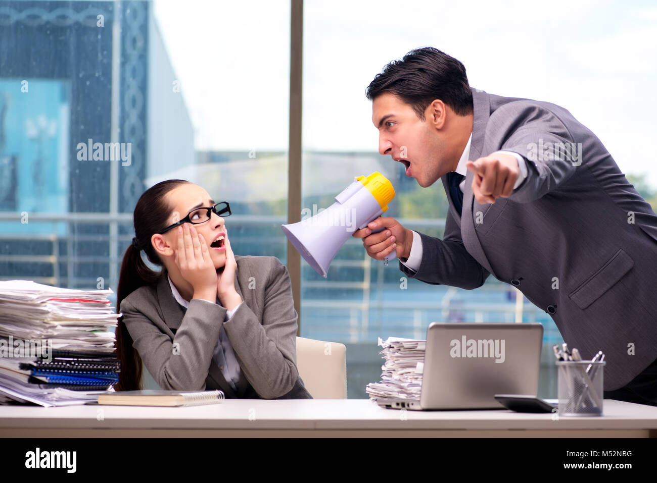 Boss yelling at his team member Stock Photo - Alamy