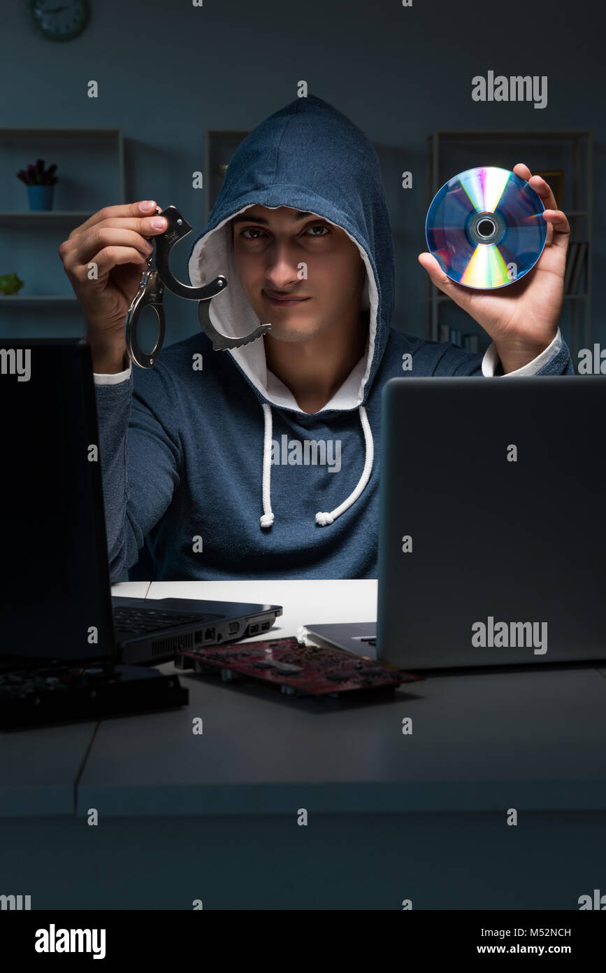Hacker hacking computer at night Stock Photo - Alamy