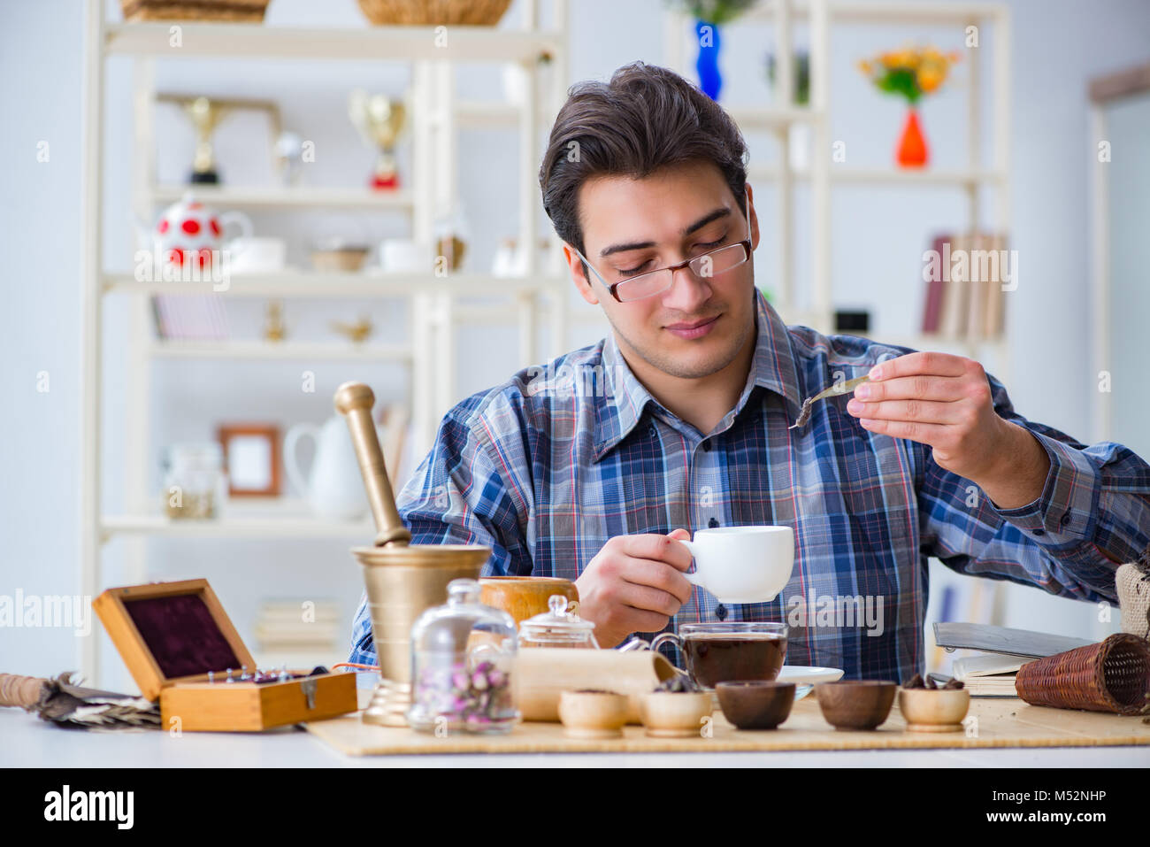 Tea expert brewing cup of drink hi-res stock photography and images - Alamy