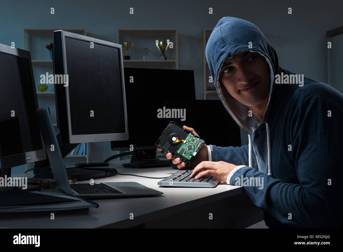 Hacker hacking computer at night Stock Photo - Alamy