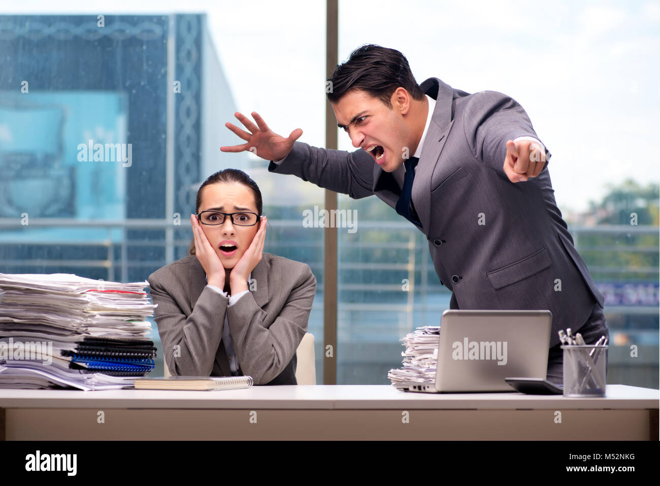 Boss yelling at his team member Stock Photo - Alamy