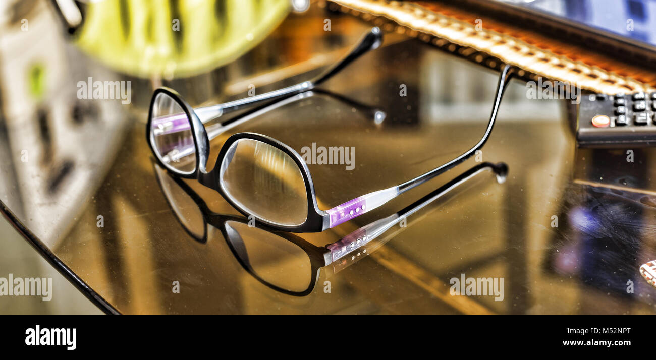 Glasses on a desk in the office Stock Photo - Alamy