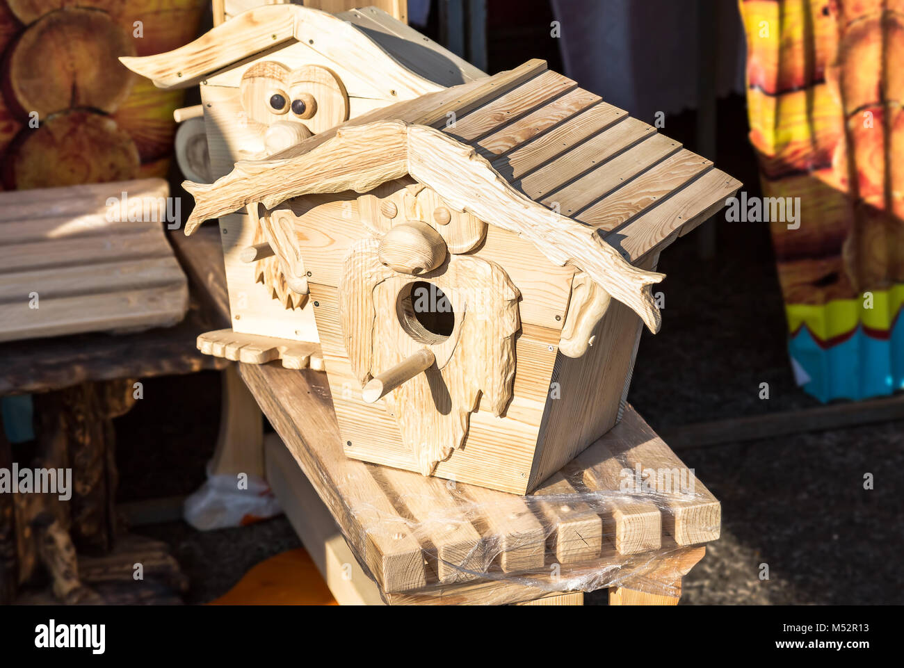 Handmade decorative wooden nesting boxes for birds Stock Photo - Alamy