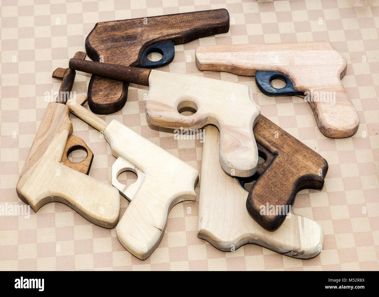 Different handmade wooden toy pistols for children Stock Photo - Alamy
