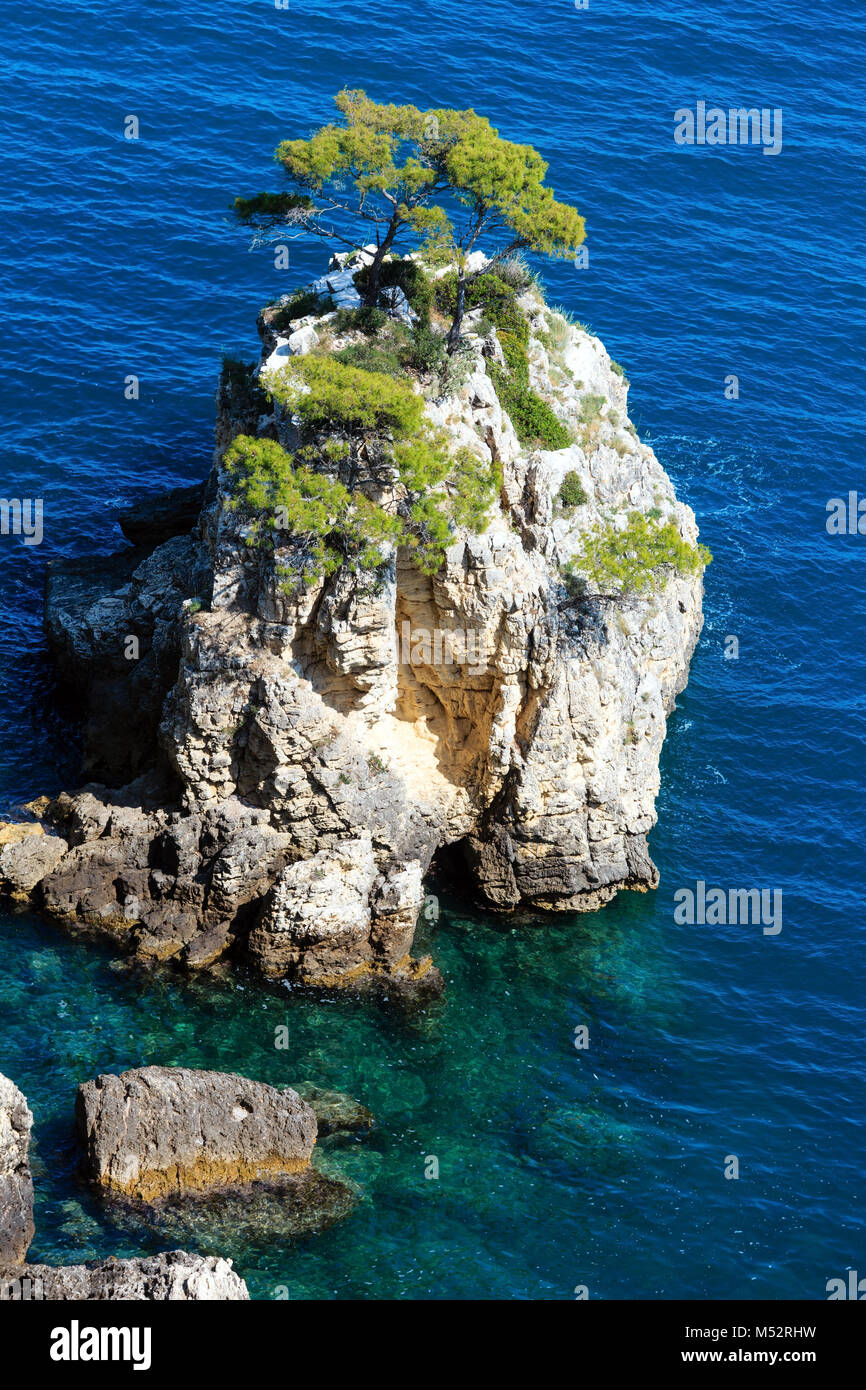 Rock near beach Cala di Porto Greco, Italy Stock Photo - Alamy