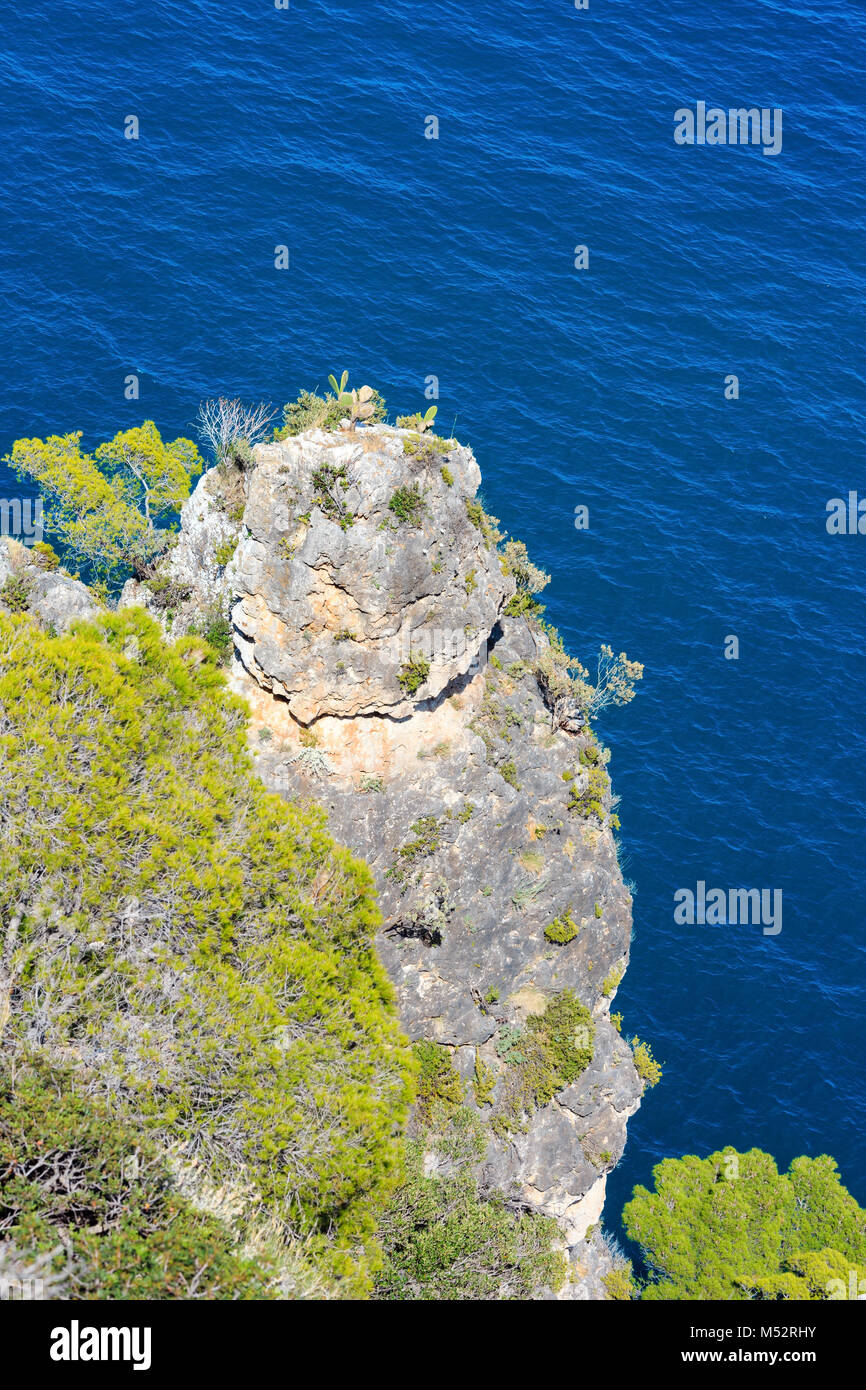 Rock above aquamarine sea surface Stock Photo - Alamy