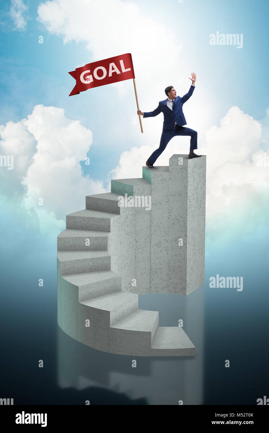 Businessman achieving his business goal objective Stock Photo - Alamy