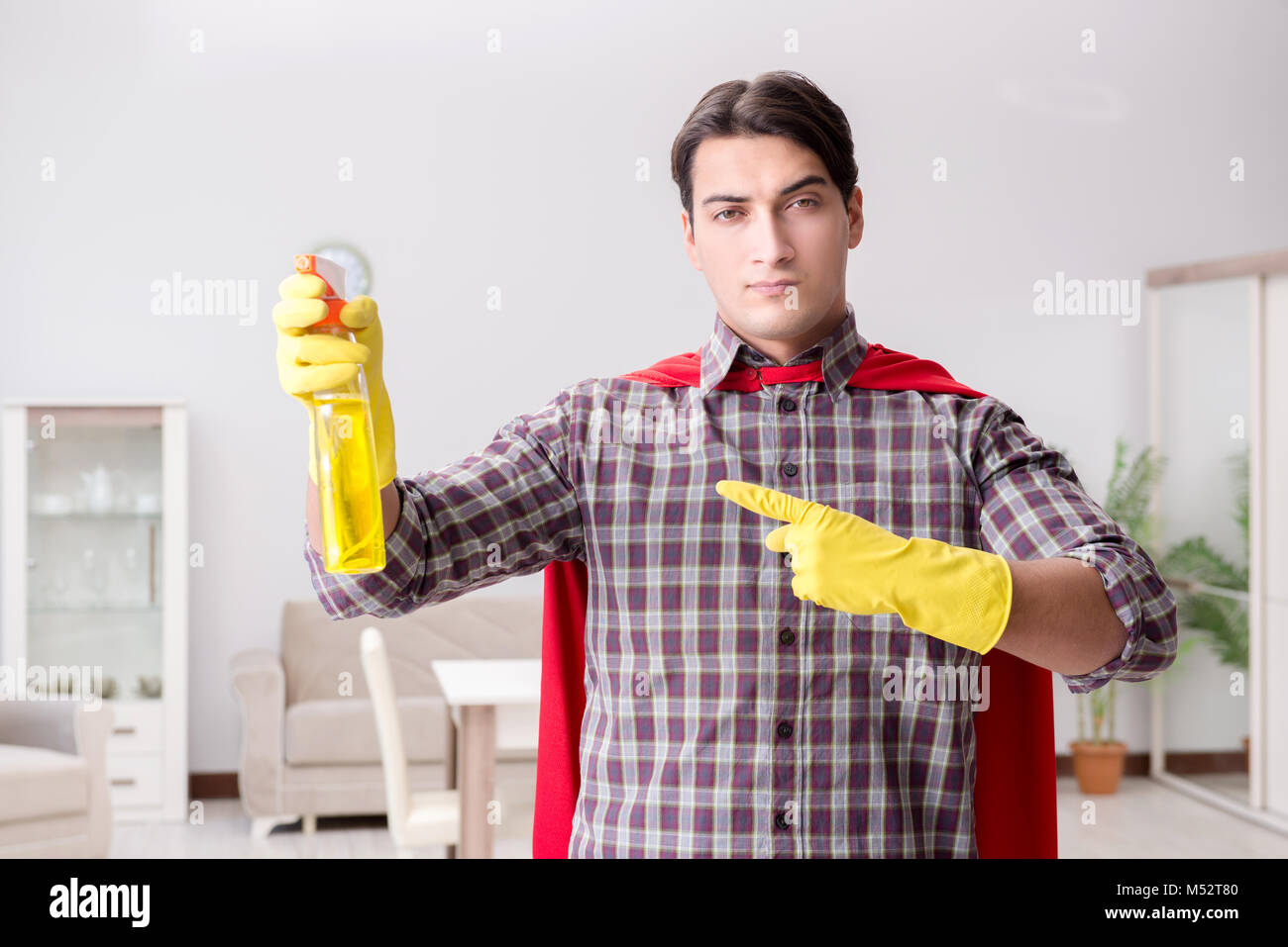 The super hero cleaner doing housework Stock Photo - Alamy