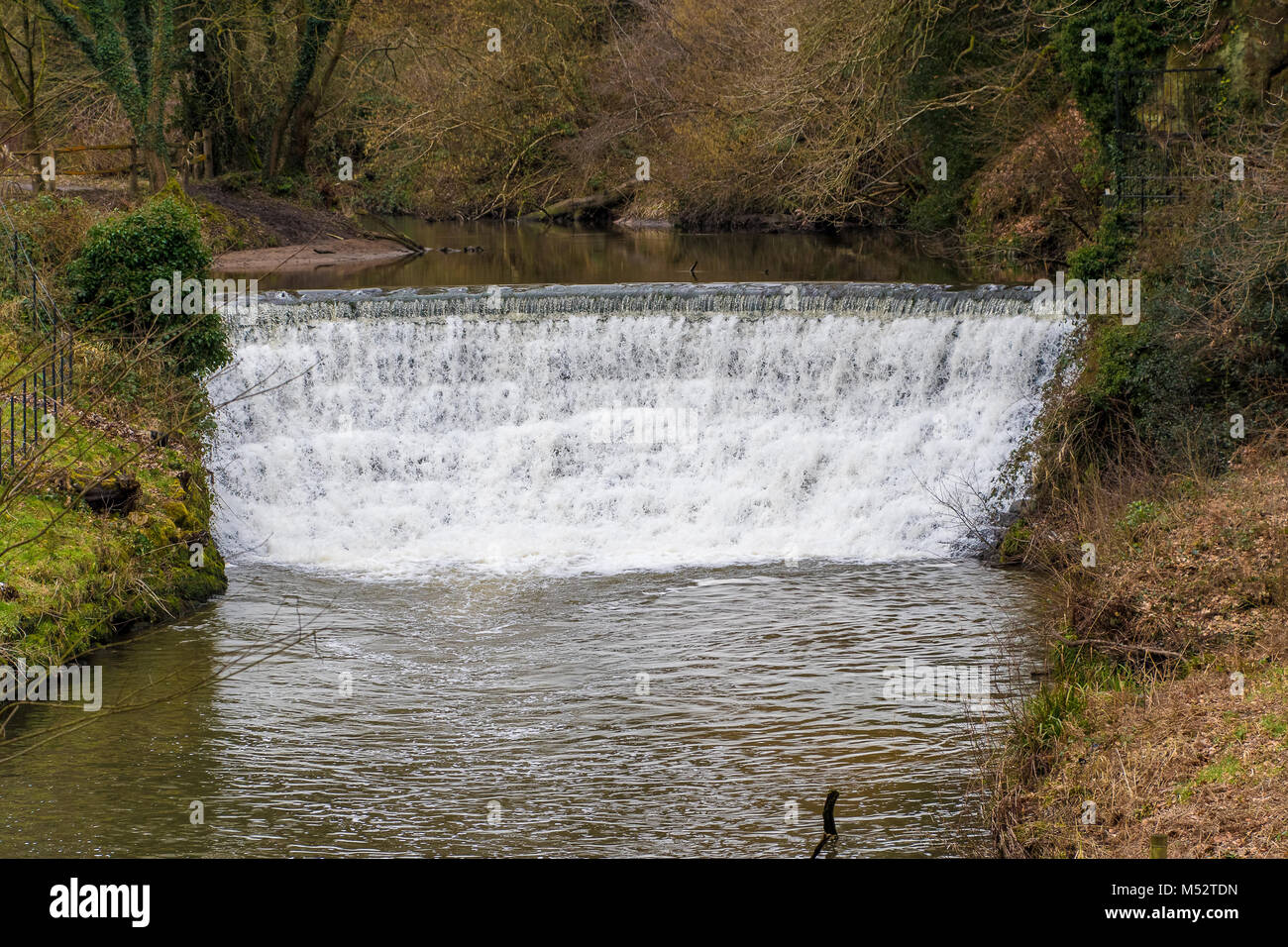 water flowing over a shallow waterfall in a river Stock Photo - Alamy
