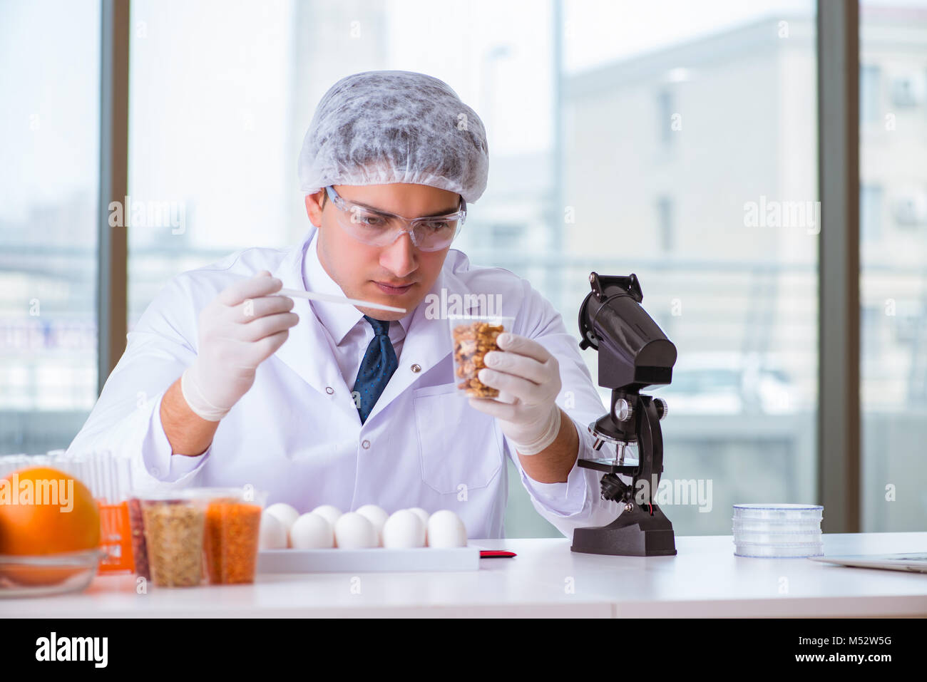Nutrition expert testing food products in lab Stock Photo - Alamy