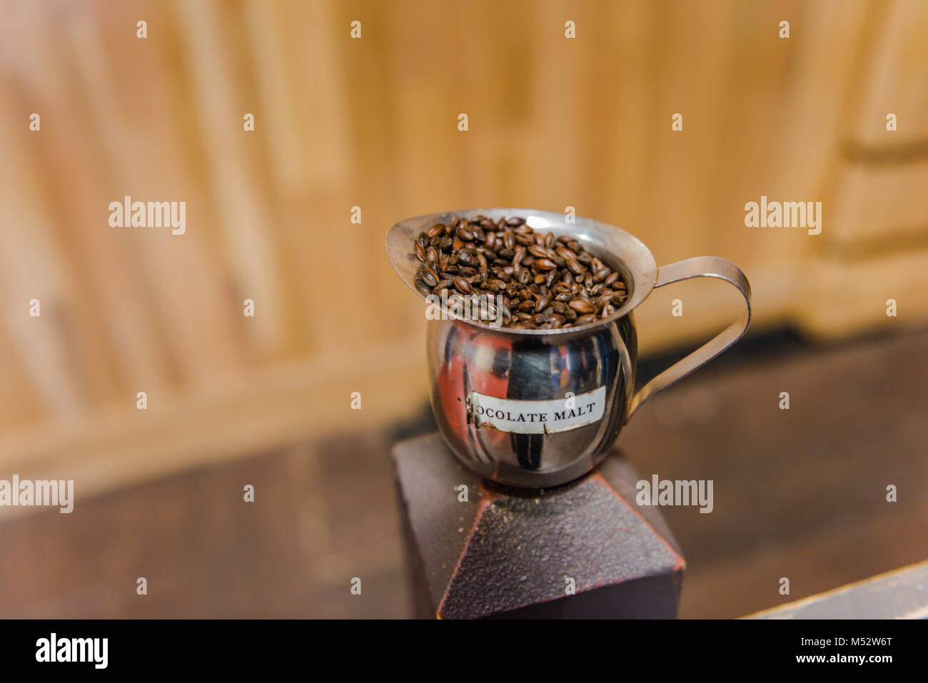 Stainless steel pitcher filled with chocolate malt, the roasted brewing ...