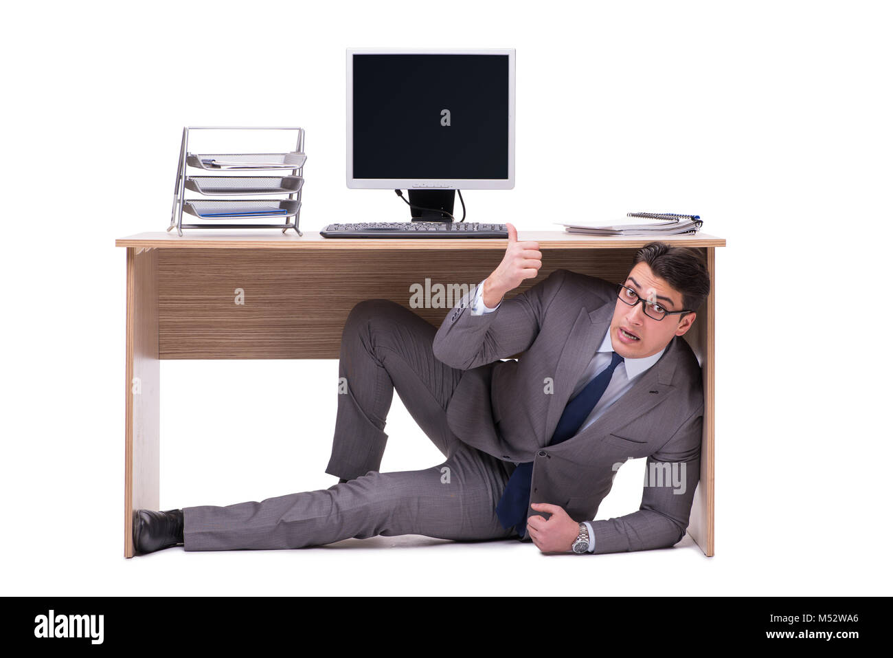 Person hiding under desk hi-res stock photography and images - Alamy