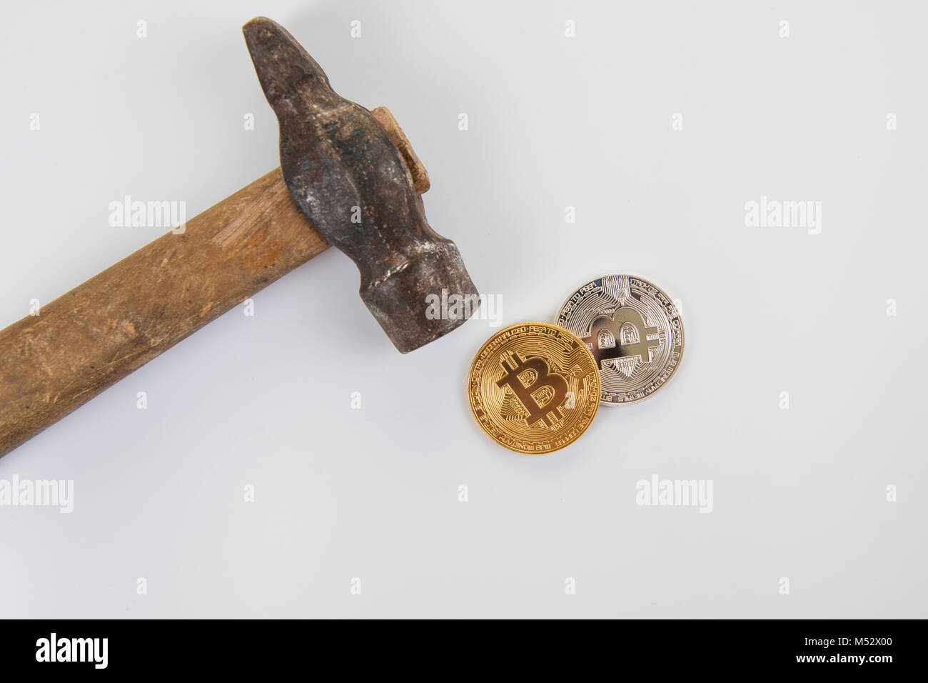 Bitcoin coins with hammer Stock Photo - Alamy