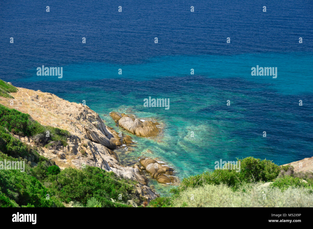 Blue sea shore under clear sky Stock Photo - Alamy