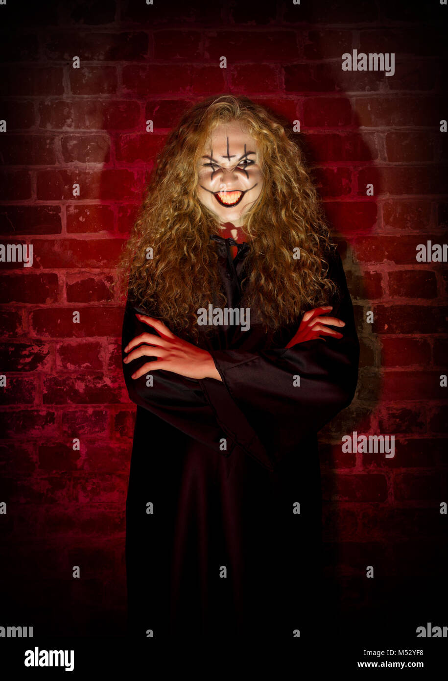Scary witch on brick wall Stock Photo - Alamy