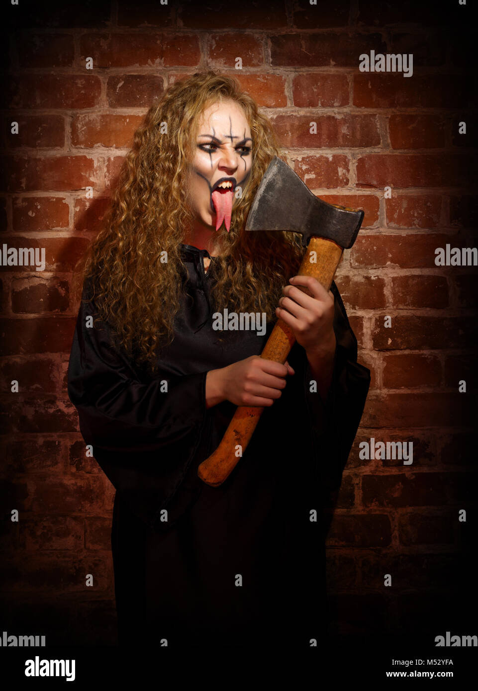 Scary witch on brick wall Stock Photo - Alamy