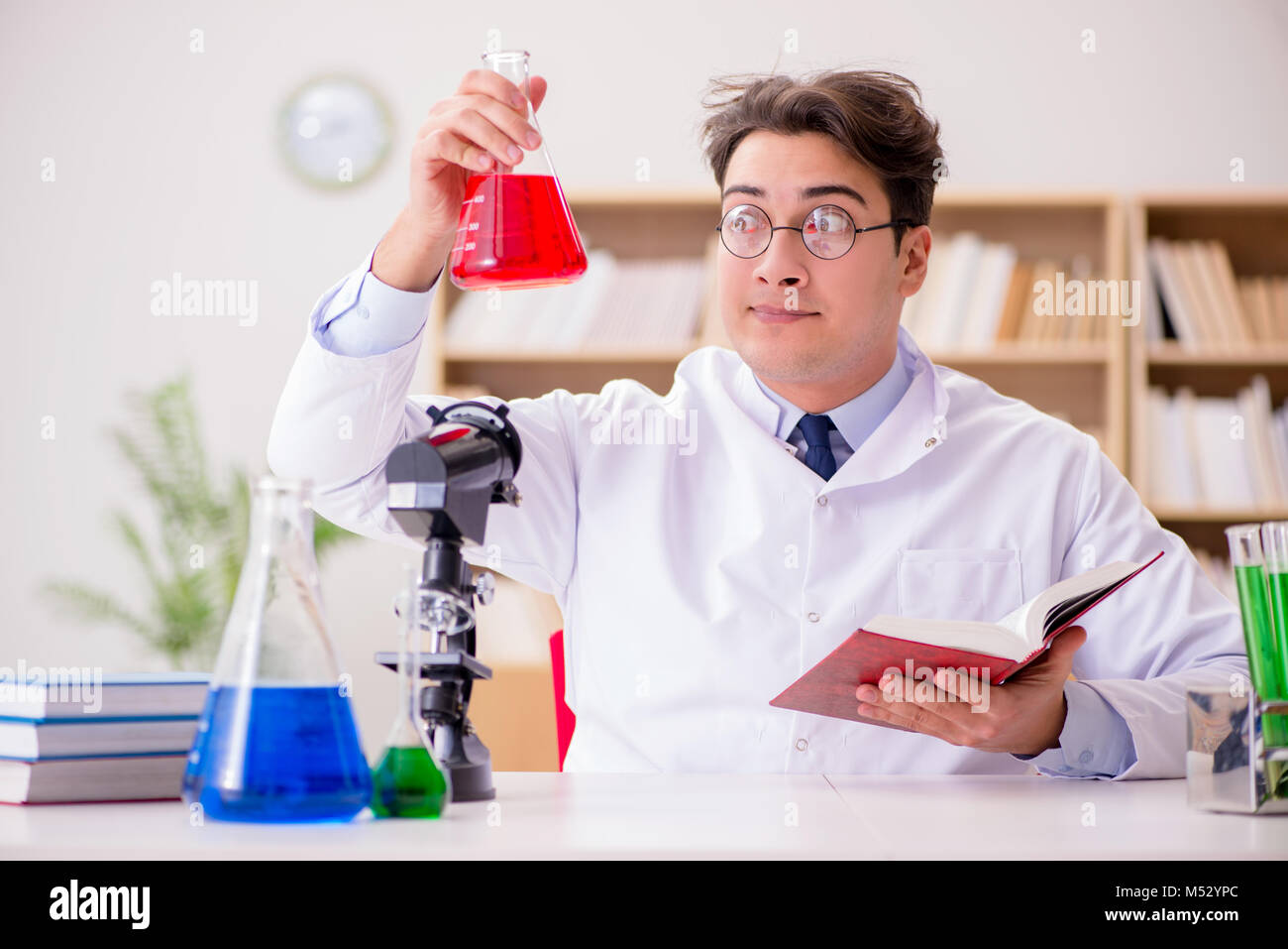 Mad crazy scientist doctor doing experiments in a laboratory Stock ...