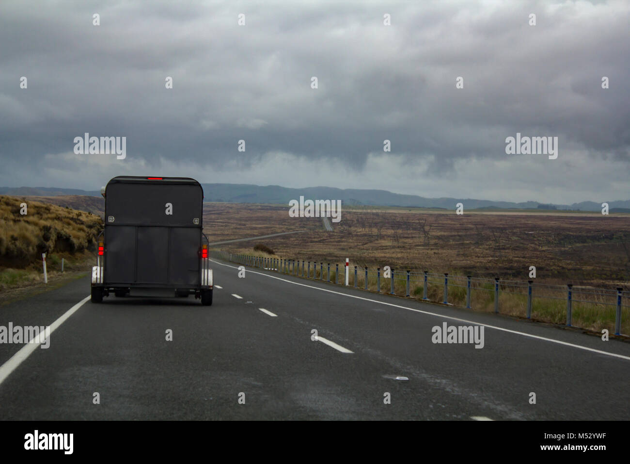 Driving through Beautiful Desert road Stock Photo - Alamy