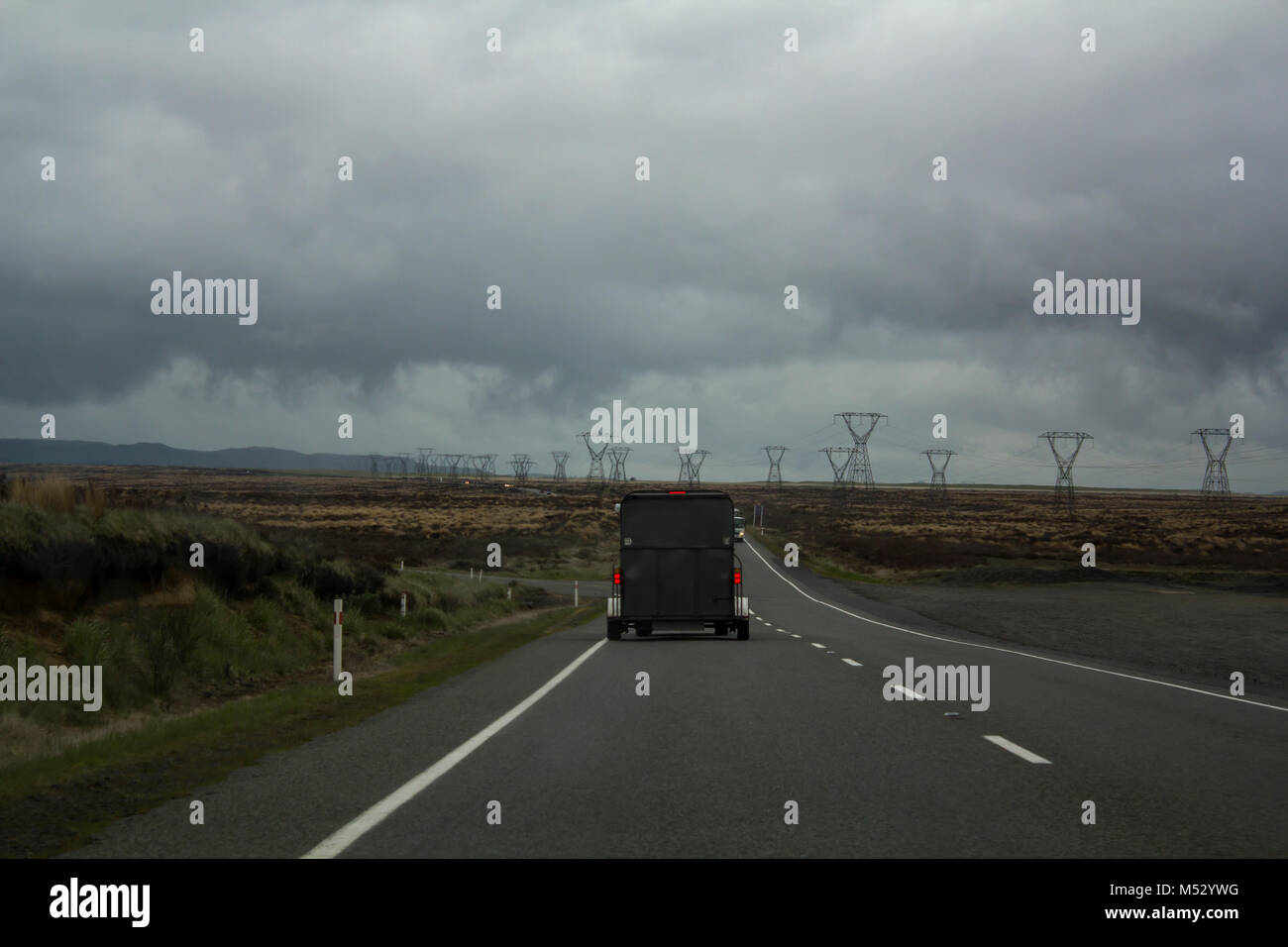 Driving through Desert road with Power Pylons on the background Stock ...
