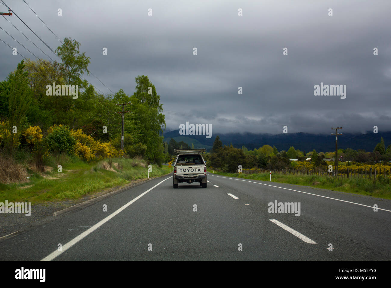 A car driving in scenic asphalt road in New Zealand Stock Photo - Alamy